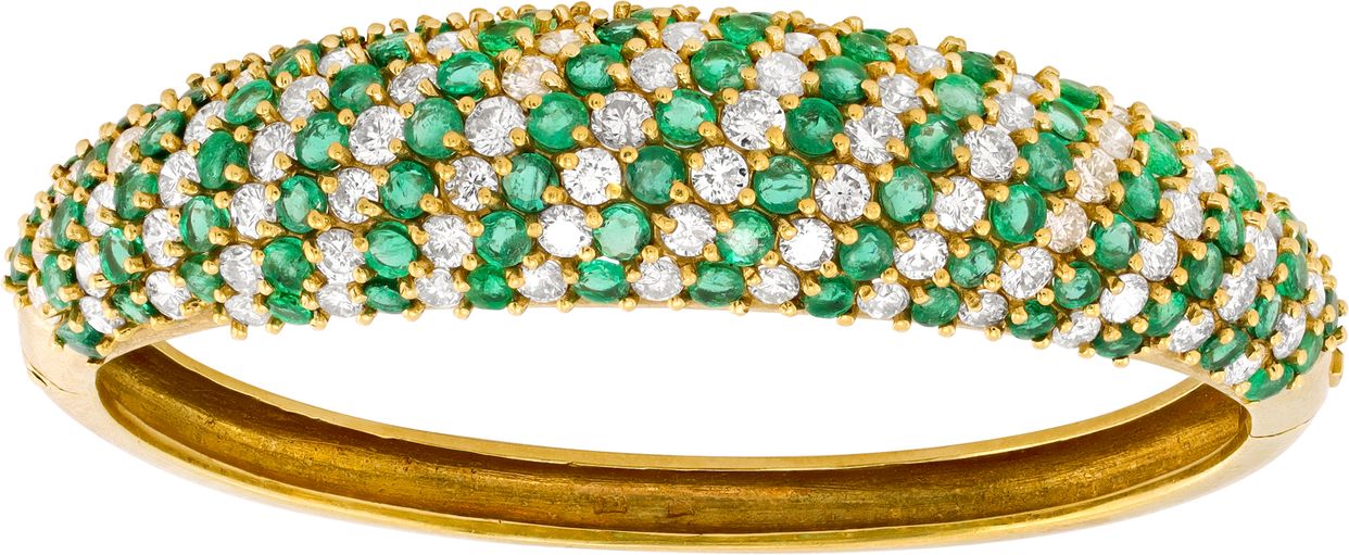 Diamond and emerald bangle in 18k yellow gold. | Gray & Sons Jewelers