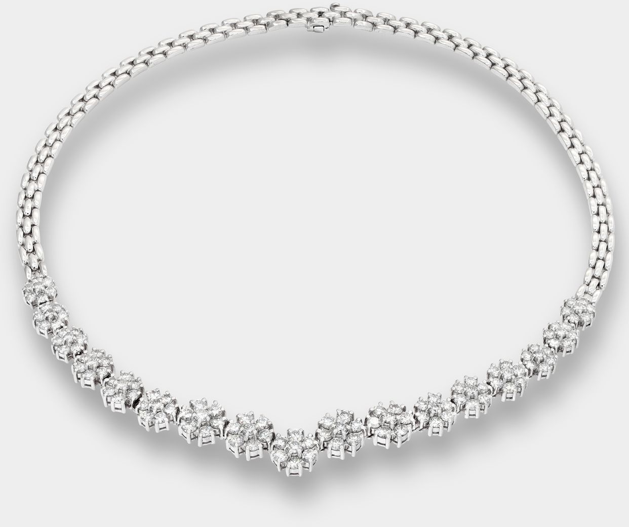 Platinum 6.00 carats diamonds graduating flower line necklace.